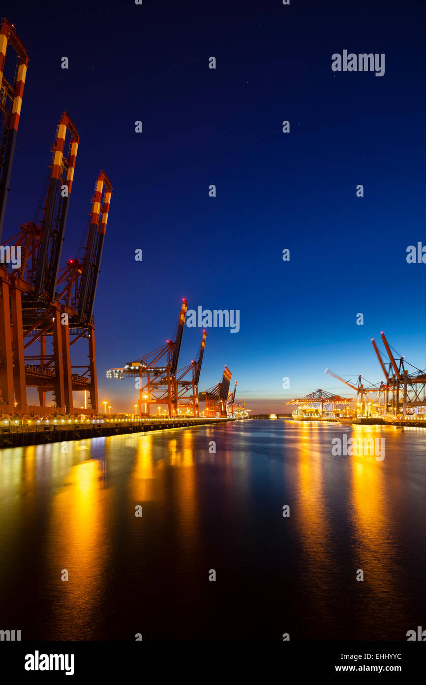 A large container harbor with deep blue night sky Stock Photo - Alamy