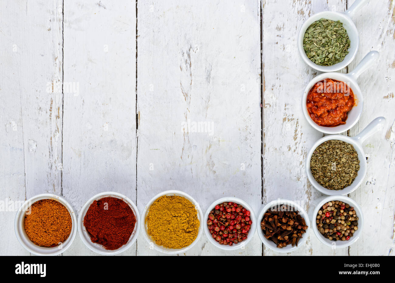 Indian spices on white wooden board Stock Photo - Alamy