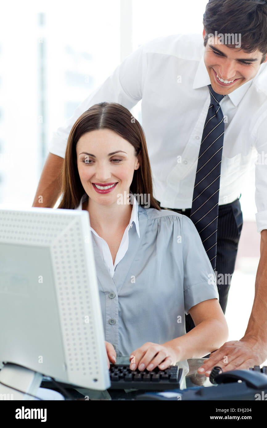Young manager helping colleague hi-res stock photography and images - Alamy