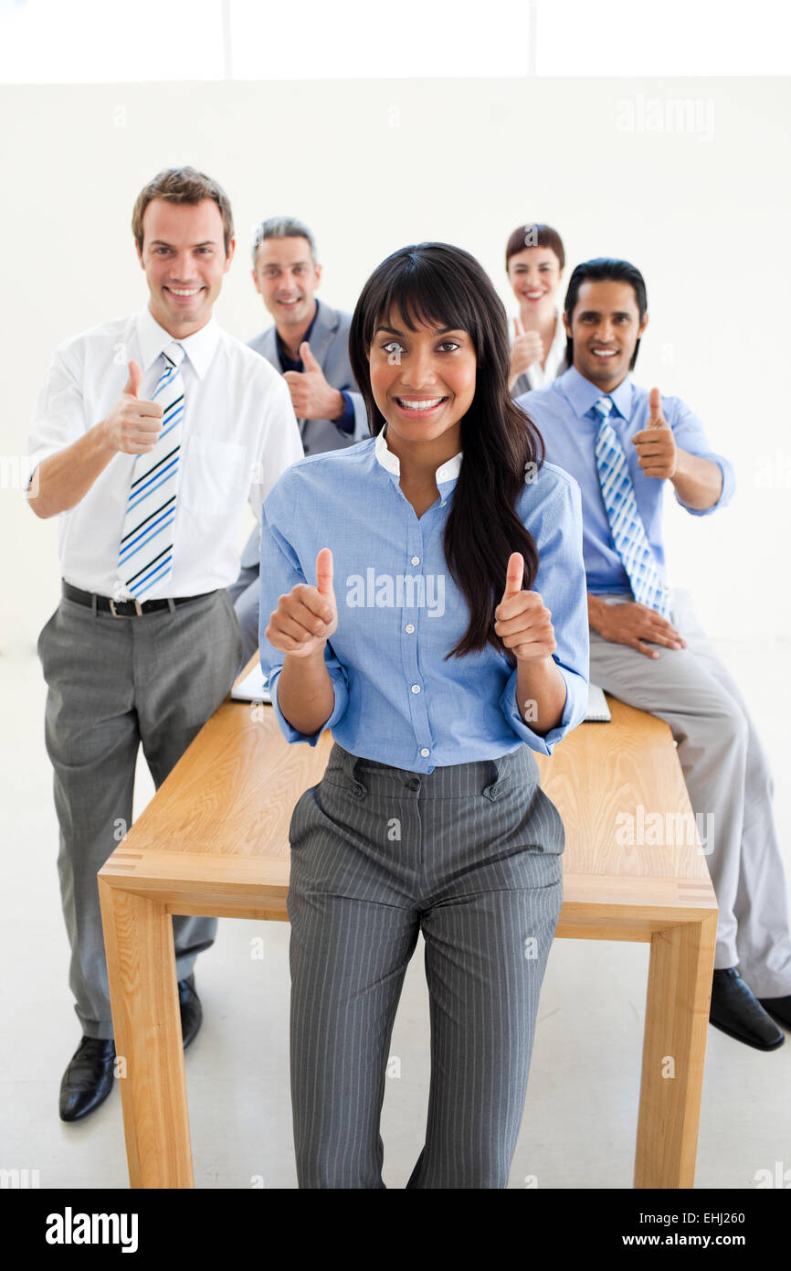 Succesfull co-workers with thumbs up Stock Photo - Alamy