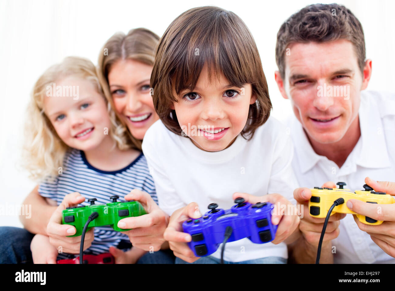 Lively family playing video game Stock Photo - Alamy
