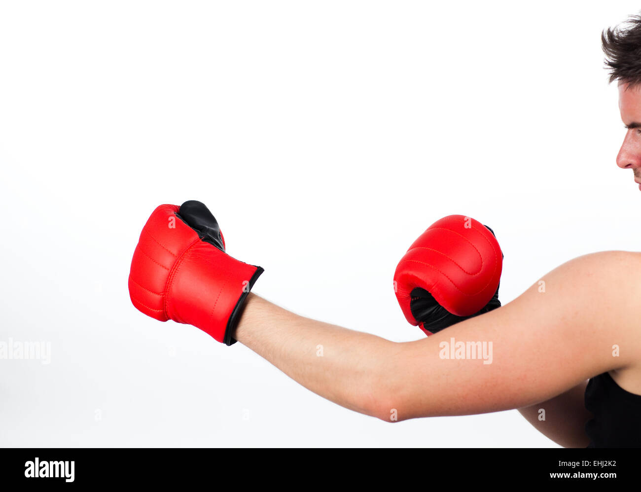 Hand in boxing glove hitting hi-res stock photography and images - Alamy