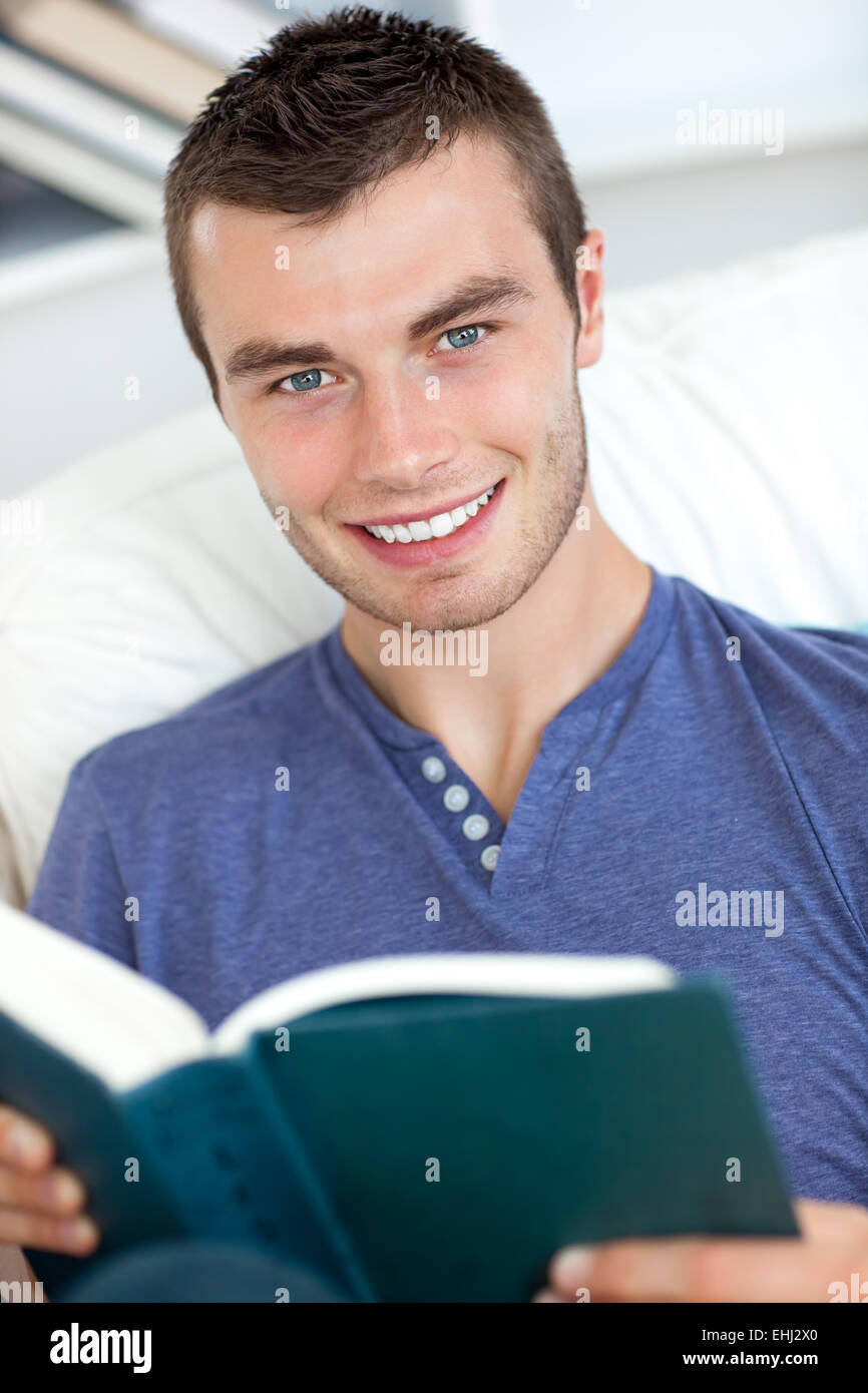 Handsome man reading a book Stock Photo - Alamy