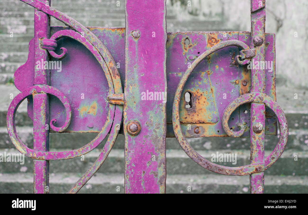 Purple iron gate closed Stock Photo - Alamy