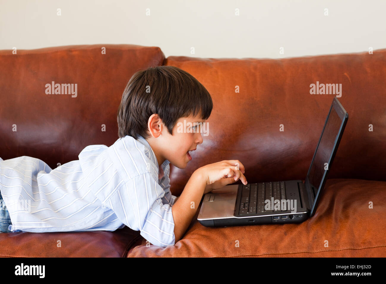Child playing with his laptop Stock Photo - Alamy
