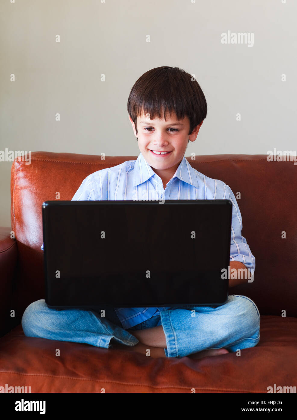 Child playing with his laptop Stock Photo - Alamy