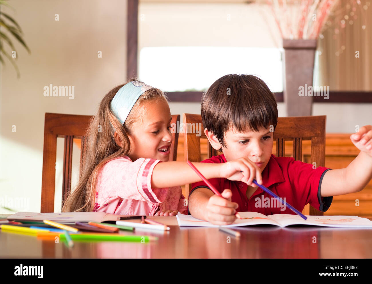 Children doing homework together Stock Photo - Alamy