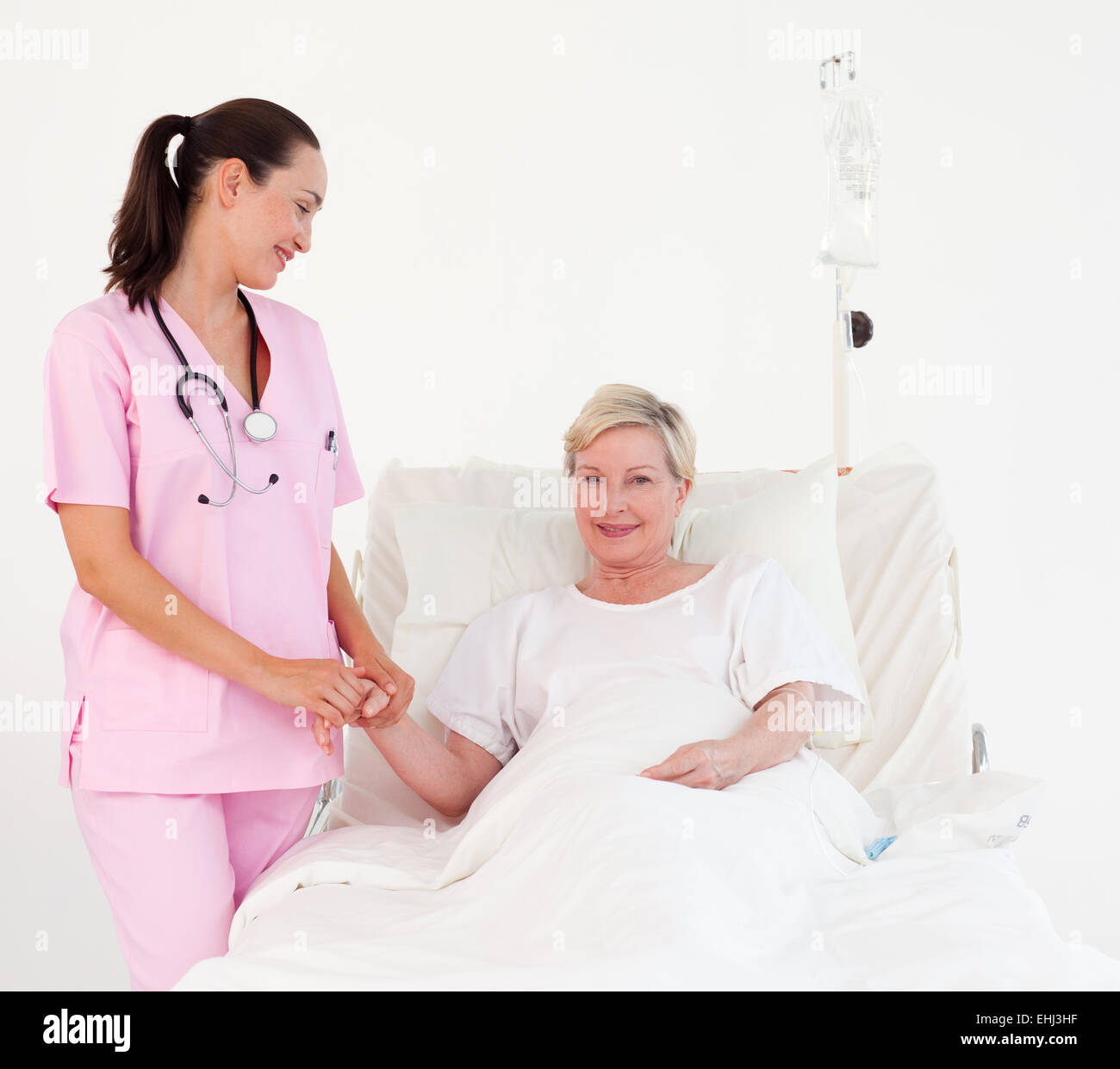 Friendly nurse and smiling female patient Stock Photo - Alamy