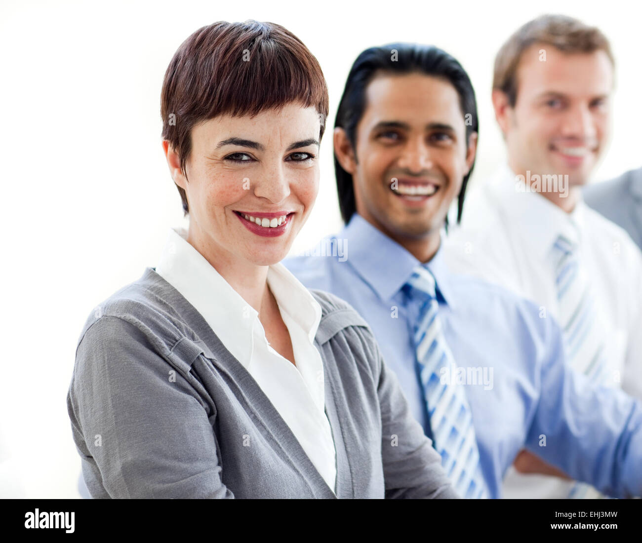 Multi-ethnic co-workers smiling at the camera Stock Photo - Alamy