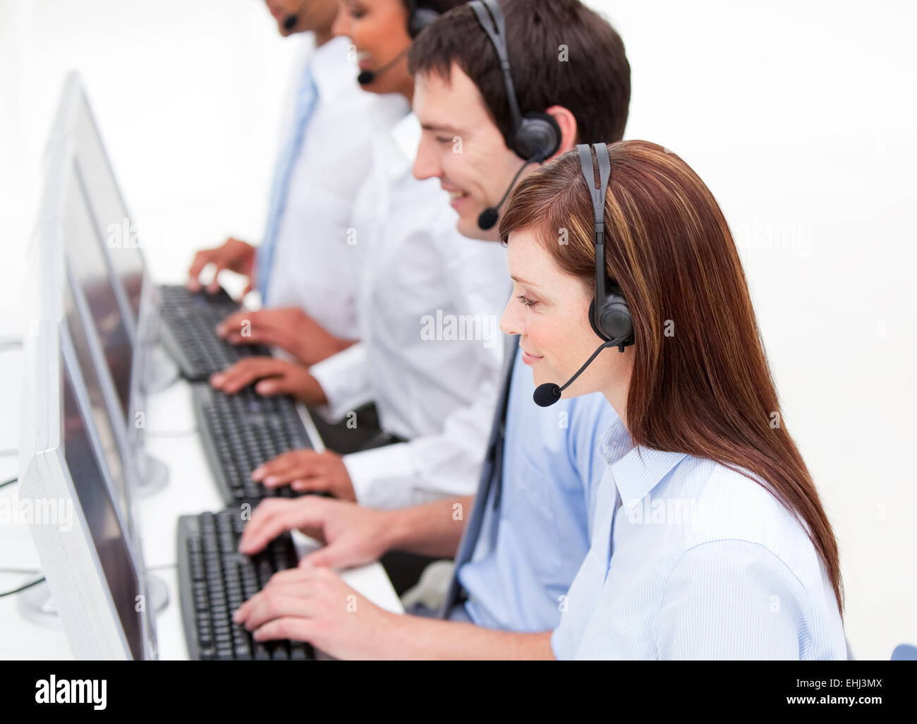 Serious customer service agents at work Stock Photo - Alamy