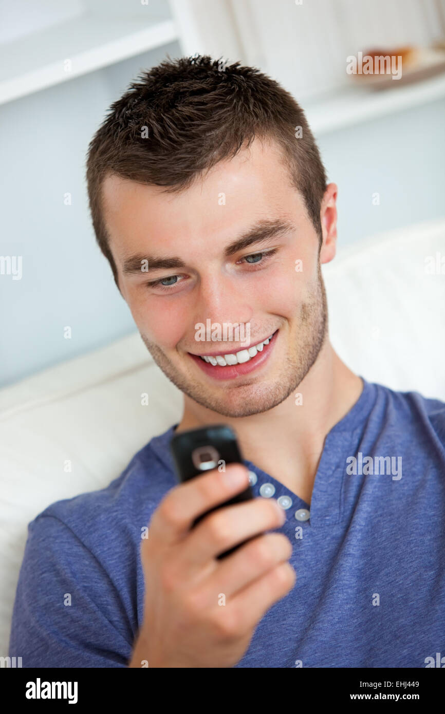 Attractive man writing a message Stock Photo - Alamy