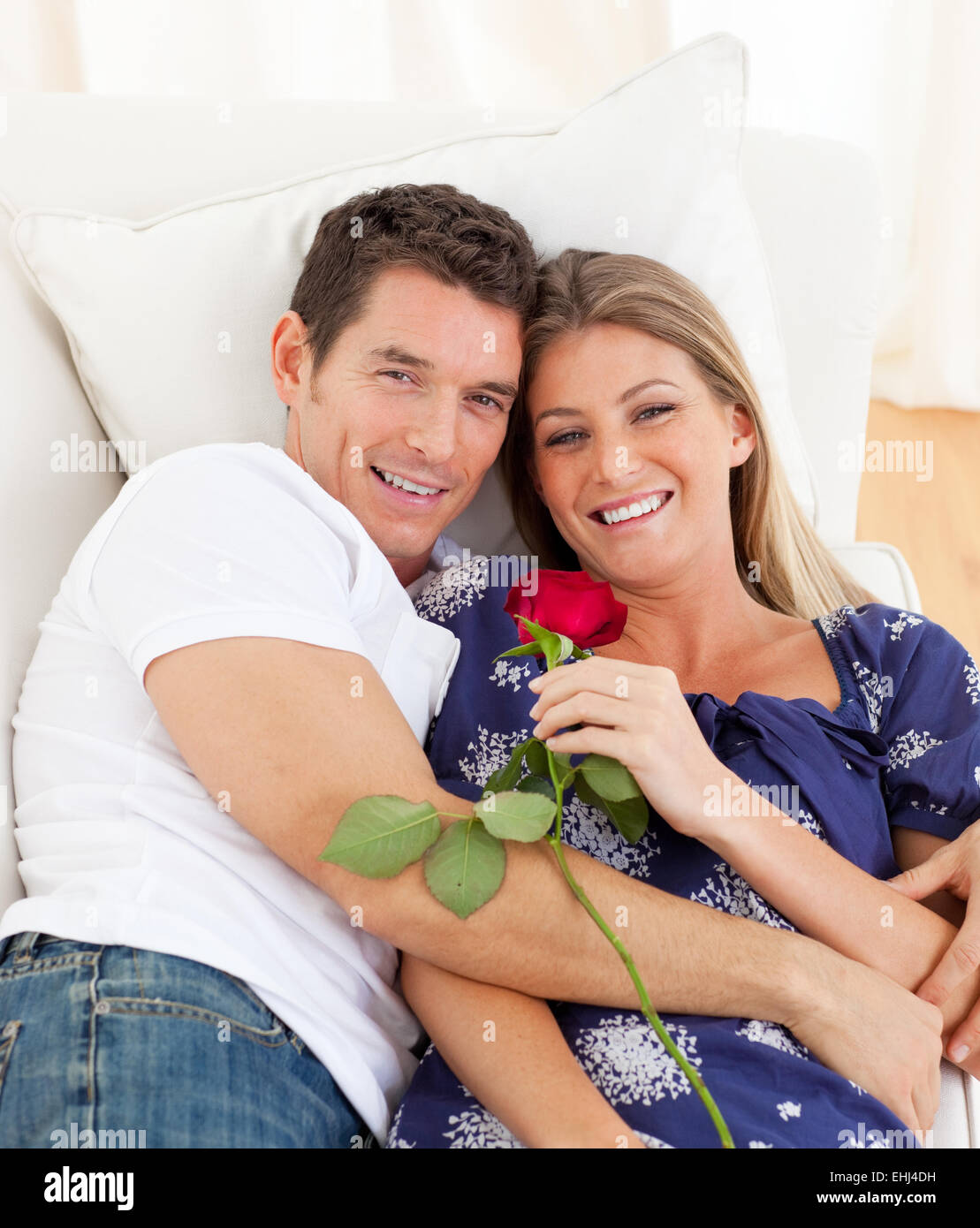 Romantic lovers relaxing on sofa Stock Photo - Alamy