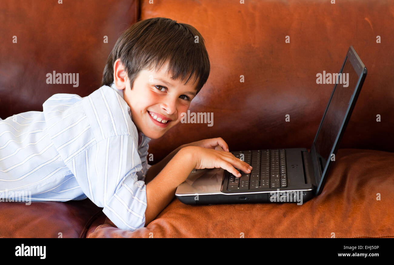 Child playing with his laptop Stock Photo - Alamy