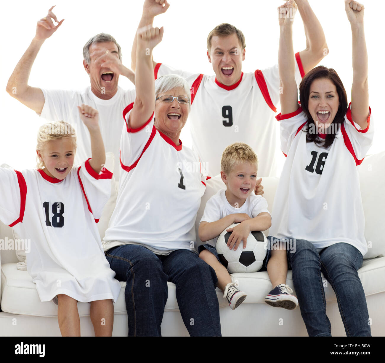 Family celebrating a goal at home Stock Photo - Alamy