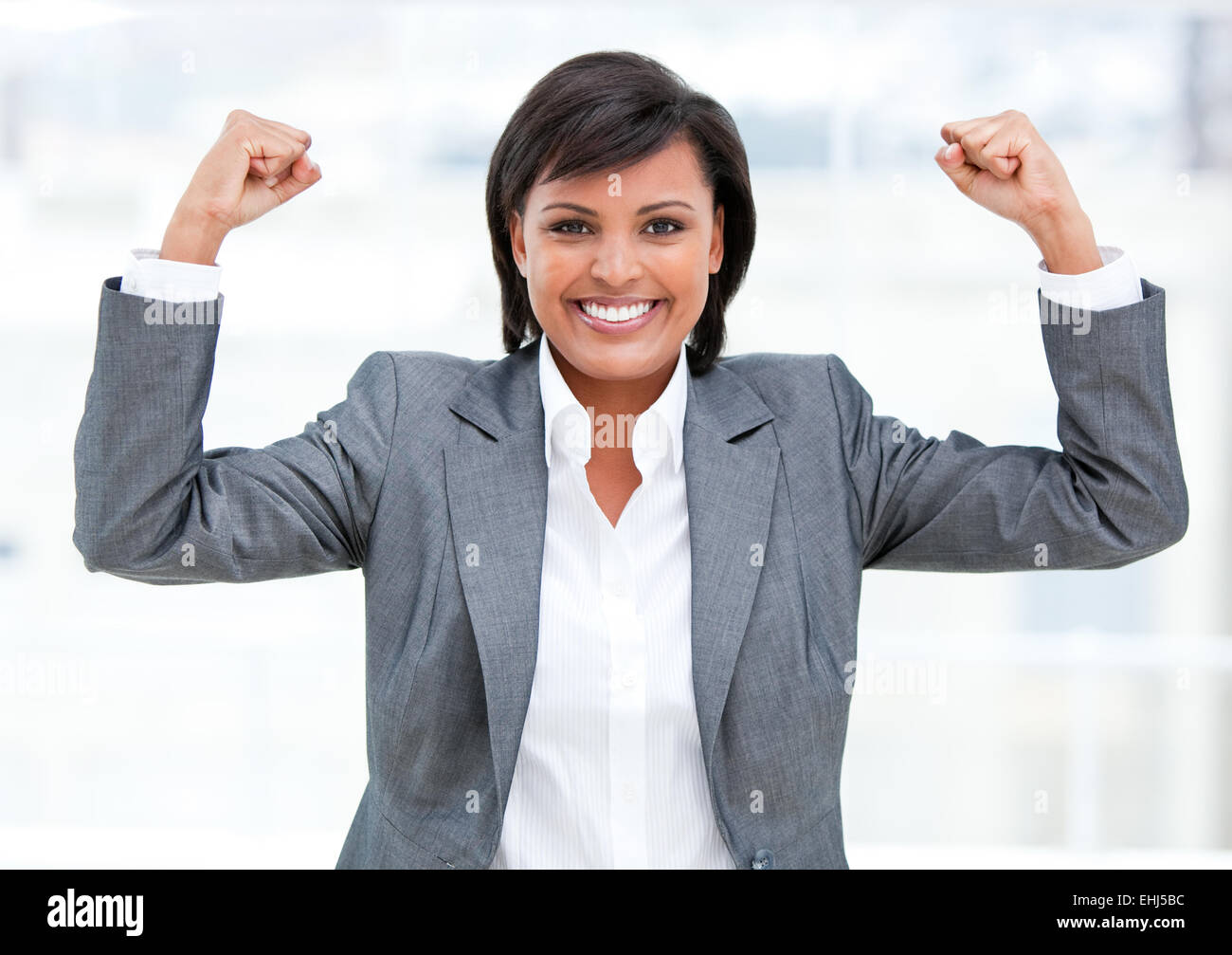 Fortunate businesswoman celebrating success Stock Photo - Alamy
