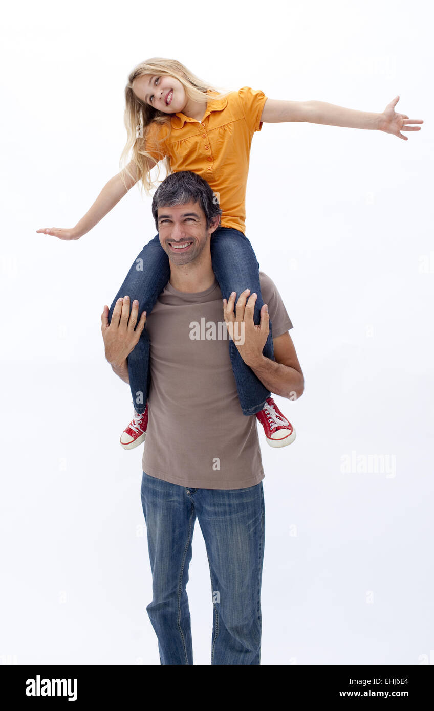 Father giving happy daughter piggyback ride Stock Photo - Alamy