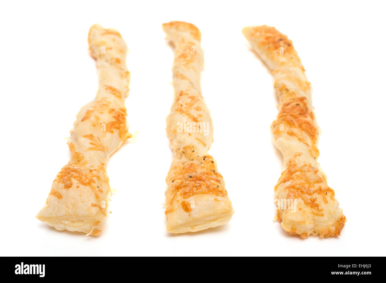Three white isolated cheese sticks with flaky pastry Stock Photo - Alamy