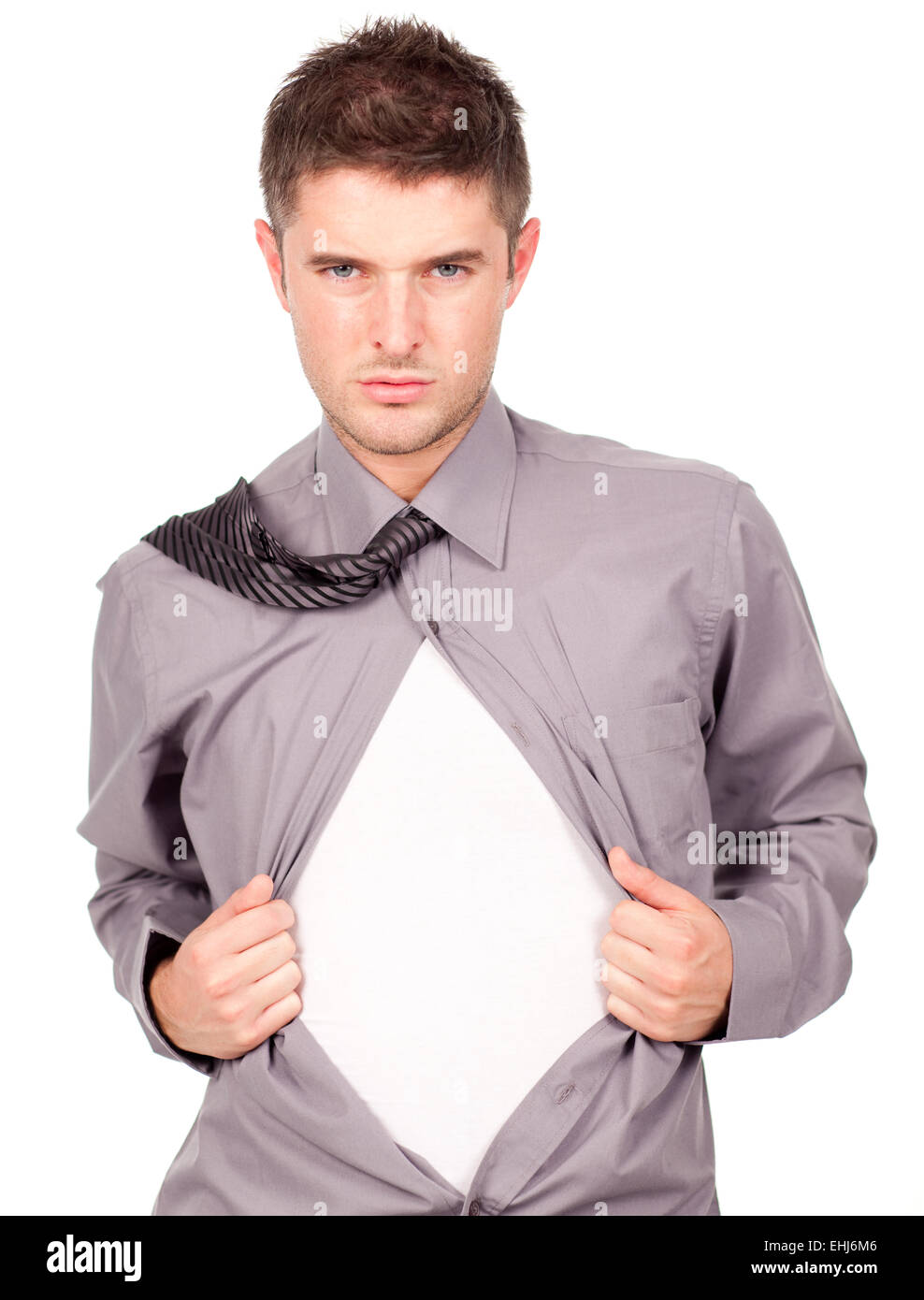 young attractive man pulling at his t-shirt Stock Photo - Alamy