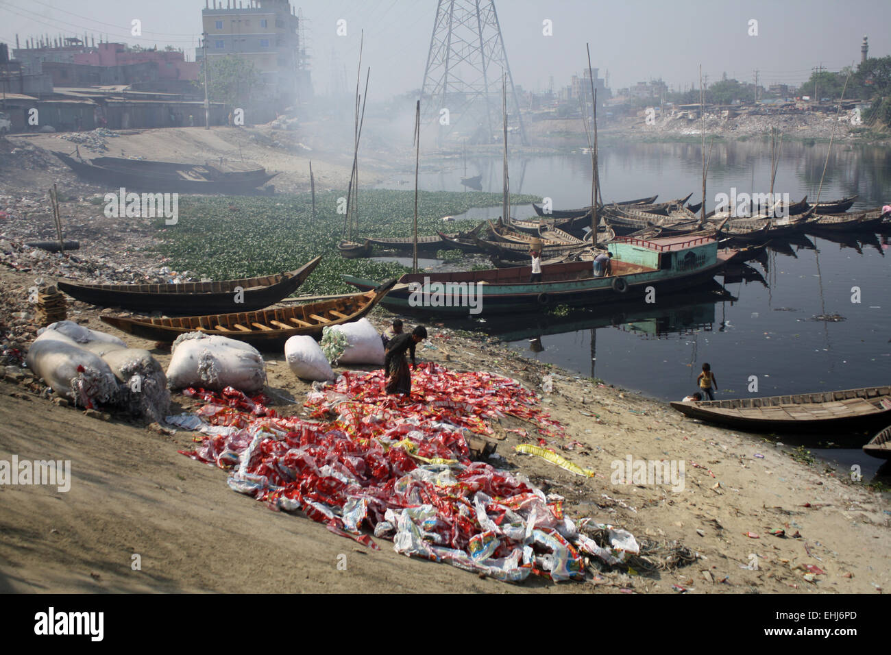 Boats in the in the polluted Buriganga River. Water pollution in the ...