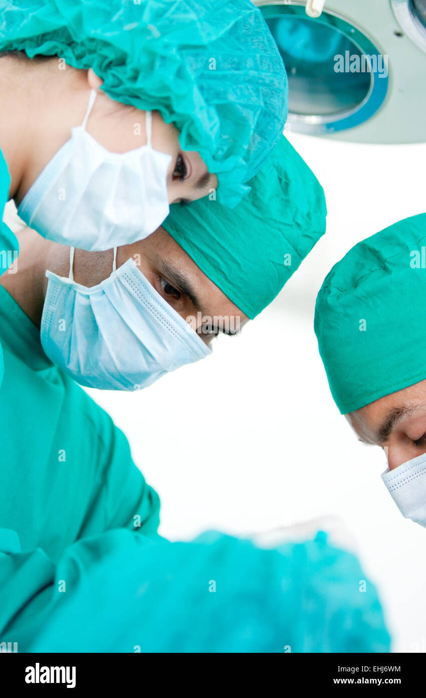 Medical partners looking at the patient Stock Photo - Alamy