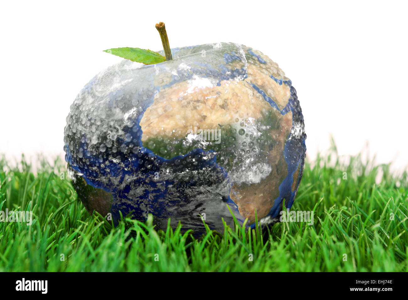 3d apple Earth on the grass Stock Photo - Alamy