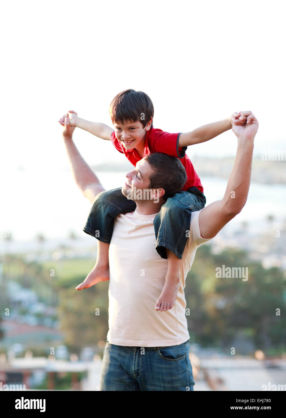 Father giving his son piggyback Stock Photo - Alamy