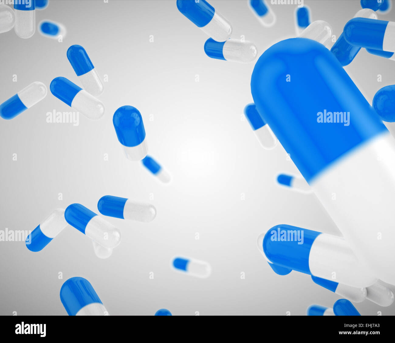 Floating blue pills Stock Photo - Alamy
