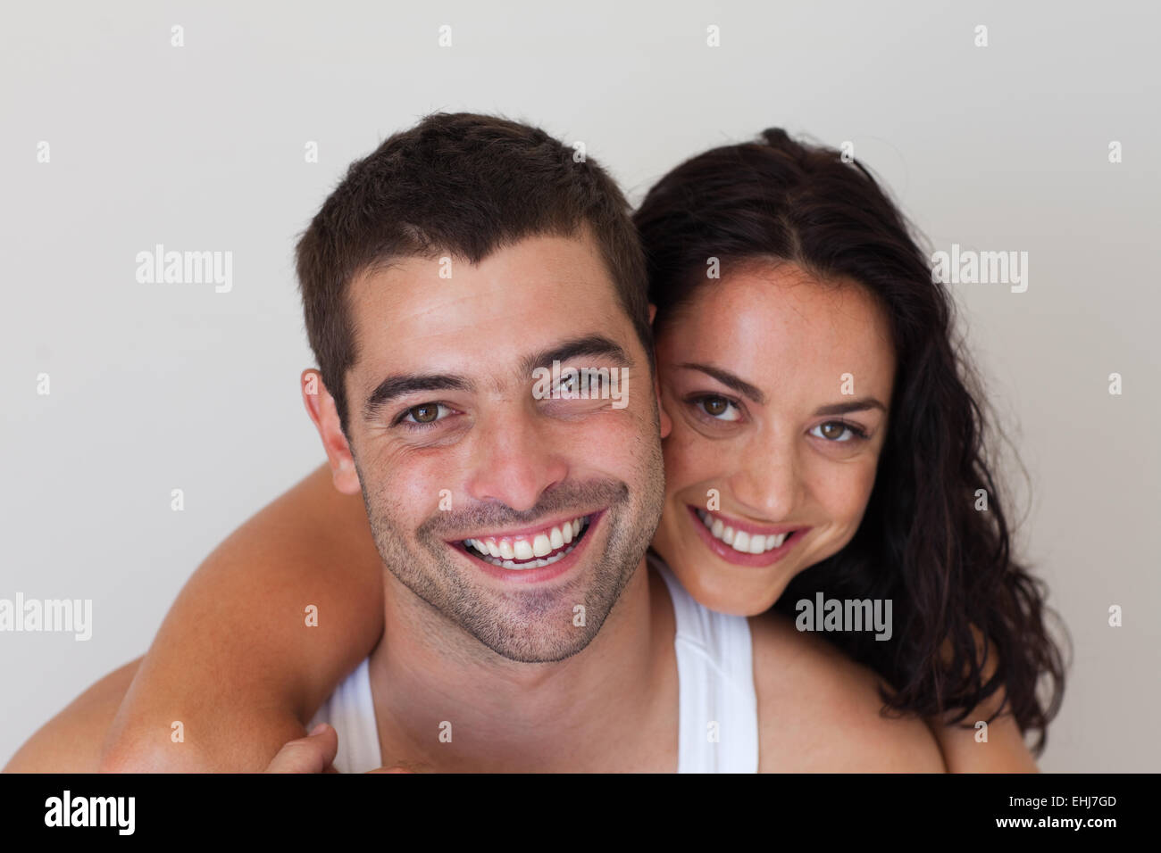 Delighted woman hugging her boyfriend Stock Photo - Alamy