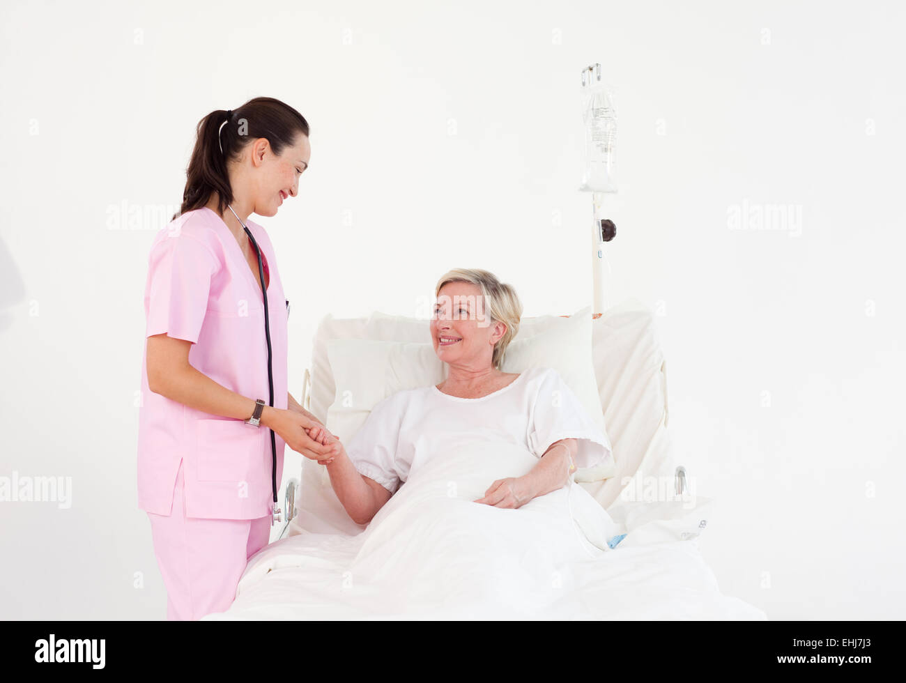 Young nurse helping a patient Stock Photo - Alamy