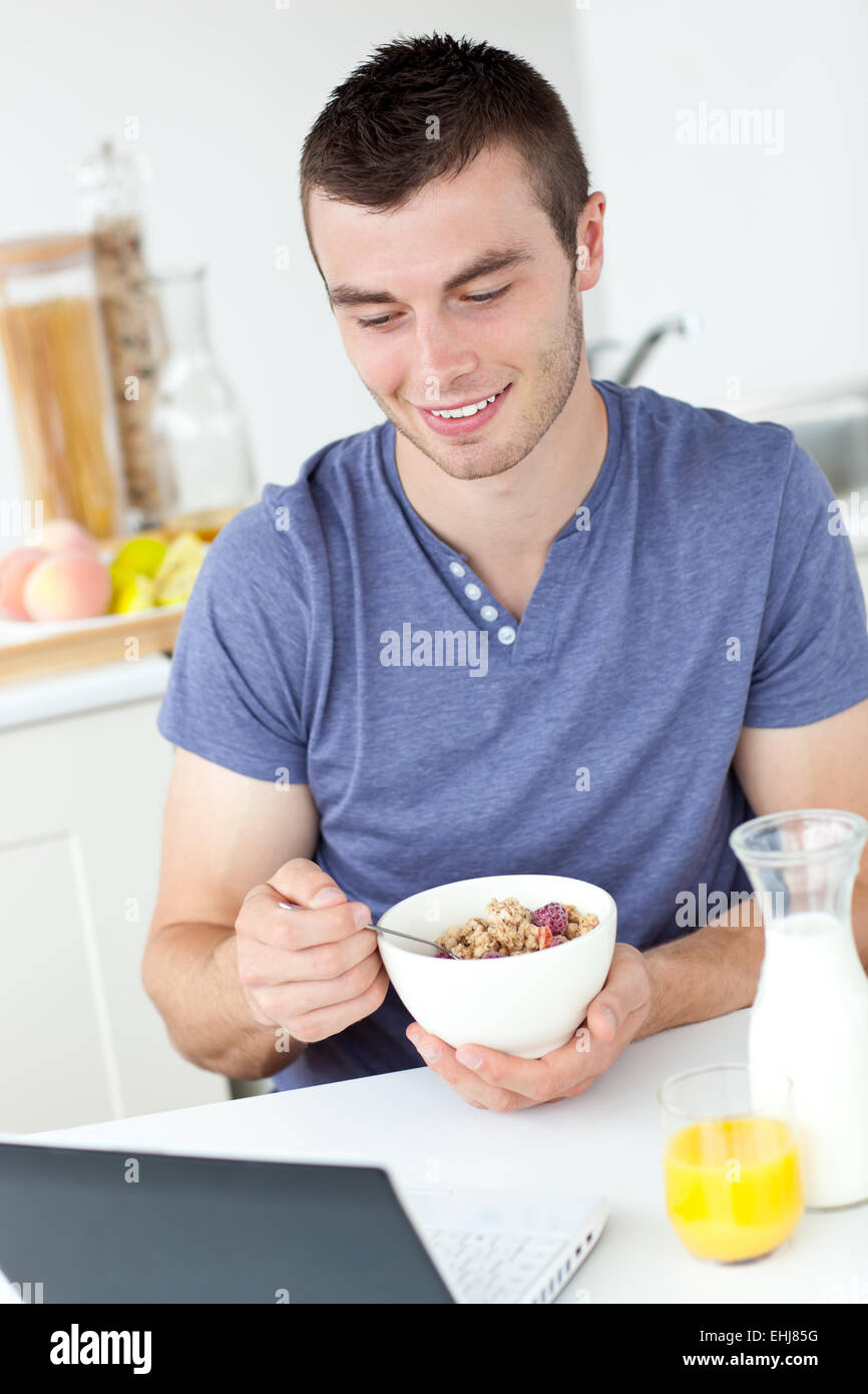 Happy man having breakfast Stock Photo - Alamy