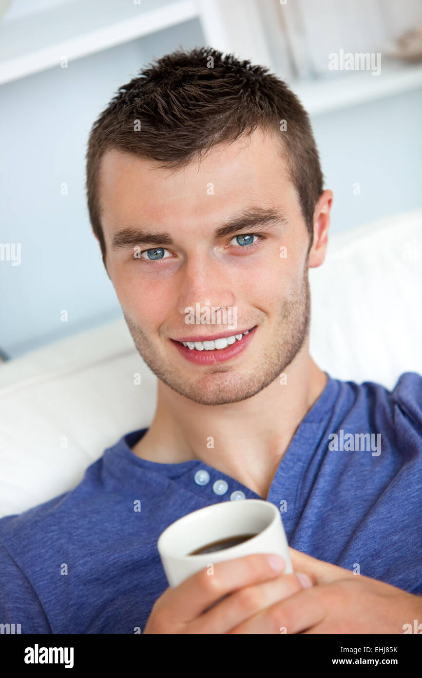 Smiling man drinking a coffee Stock Photo - Alamy