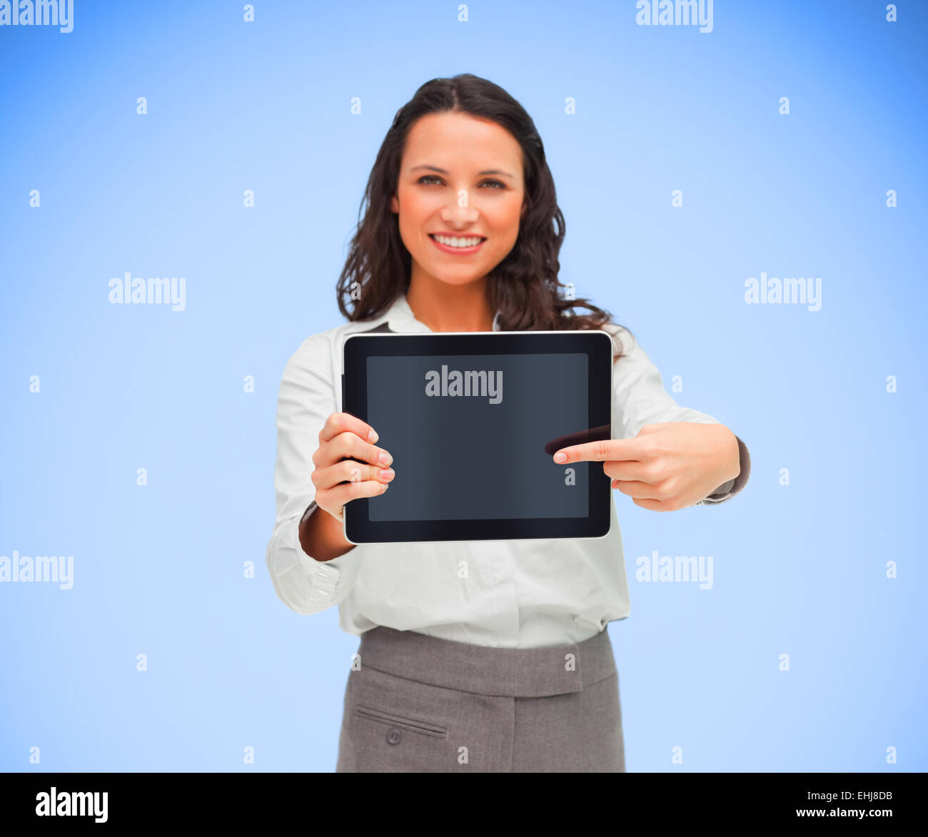 Businesswoman pointing on her digital tablet Stock Photo - Alamy