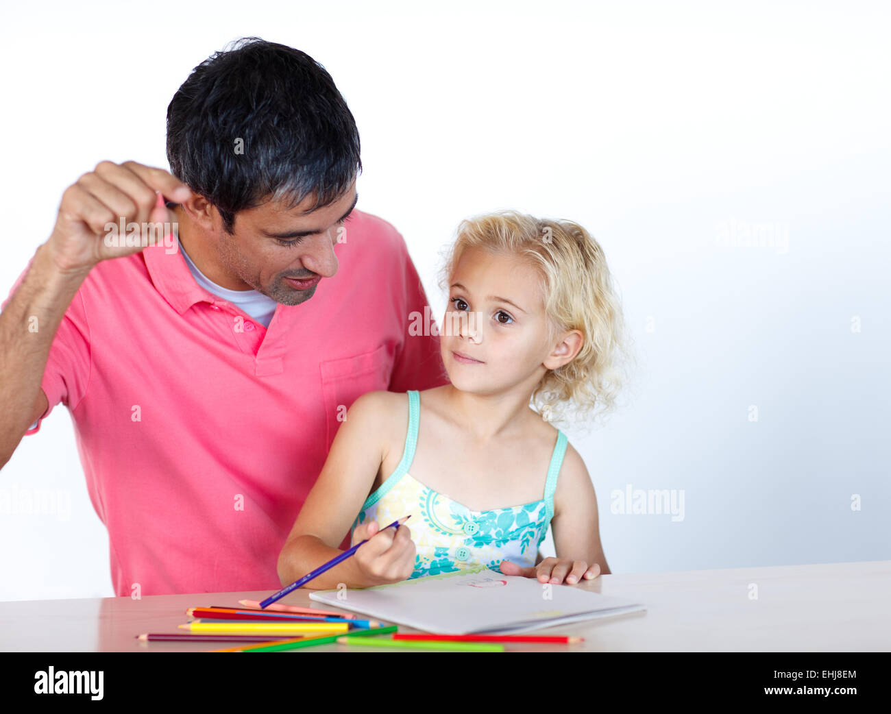 Dad and daughter doing homework together Stock Photo - Alamy