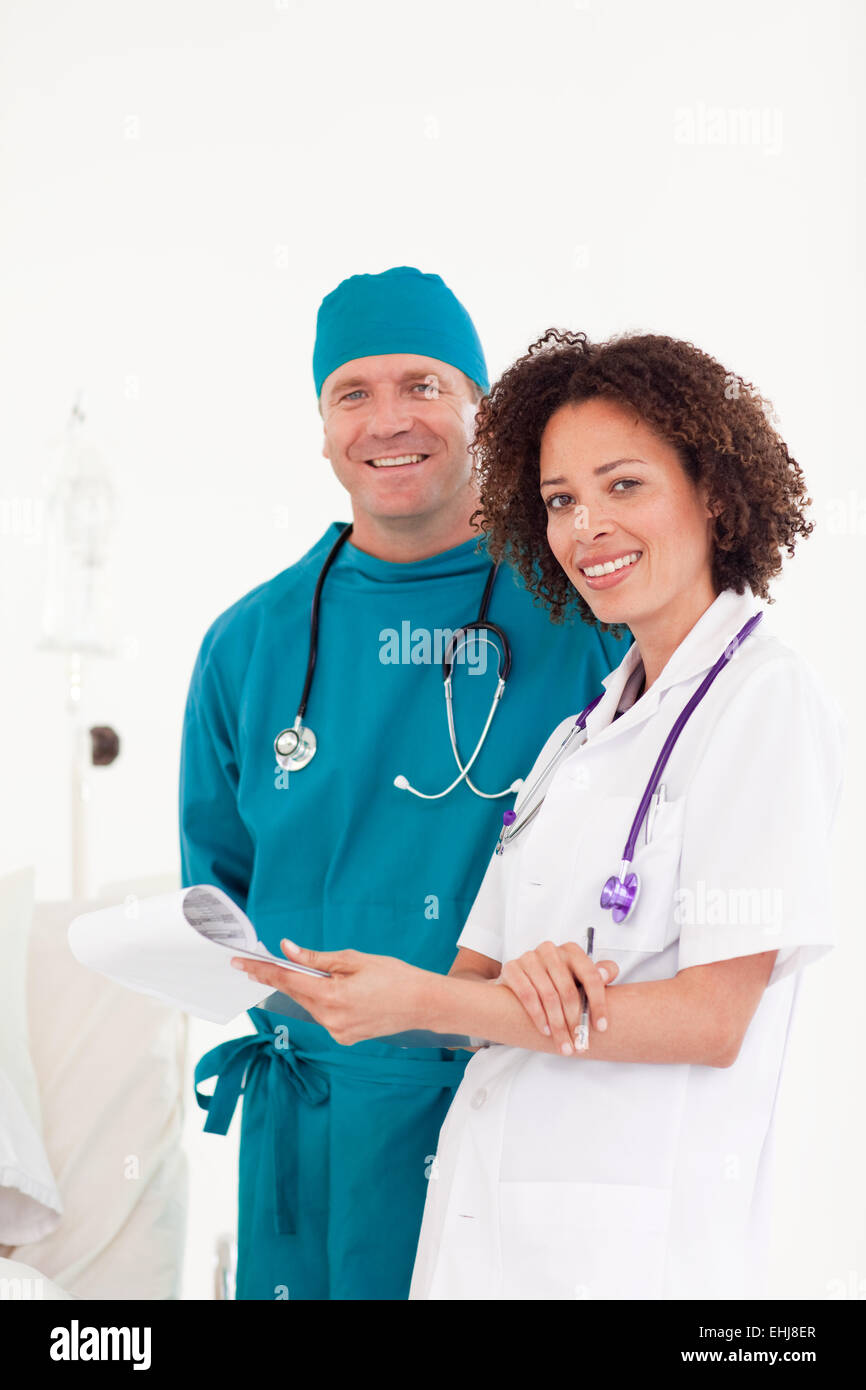 Friendly nurse with attractive surgeon Stock Photo - Alamy