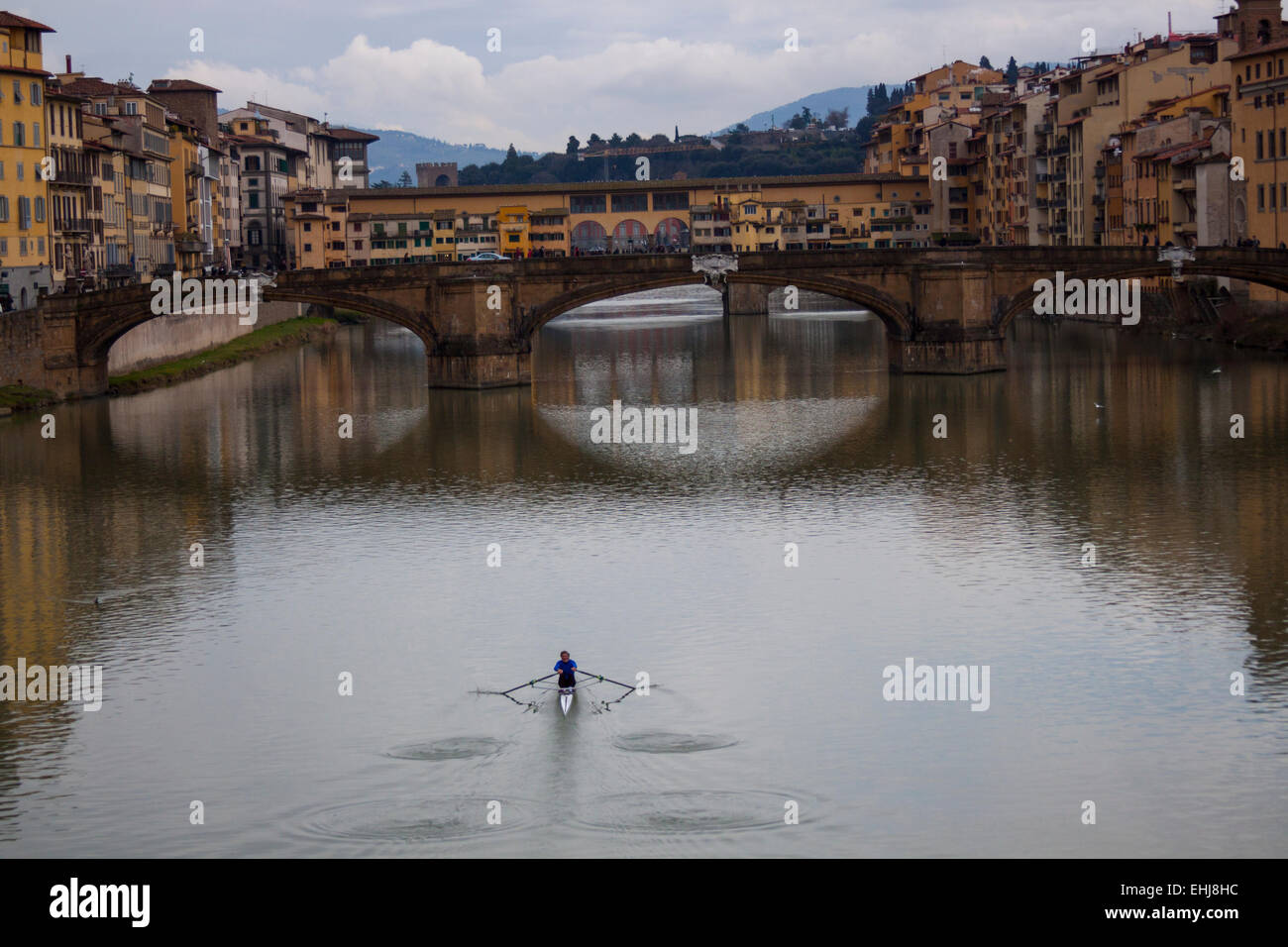 A single rower in the Arno River, Florence Stock Photo - Alamy