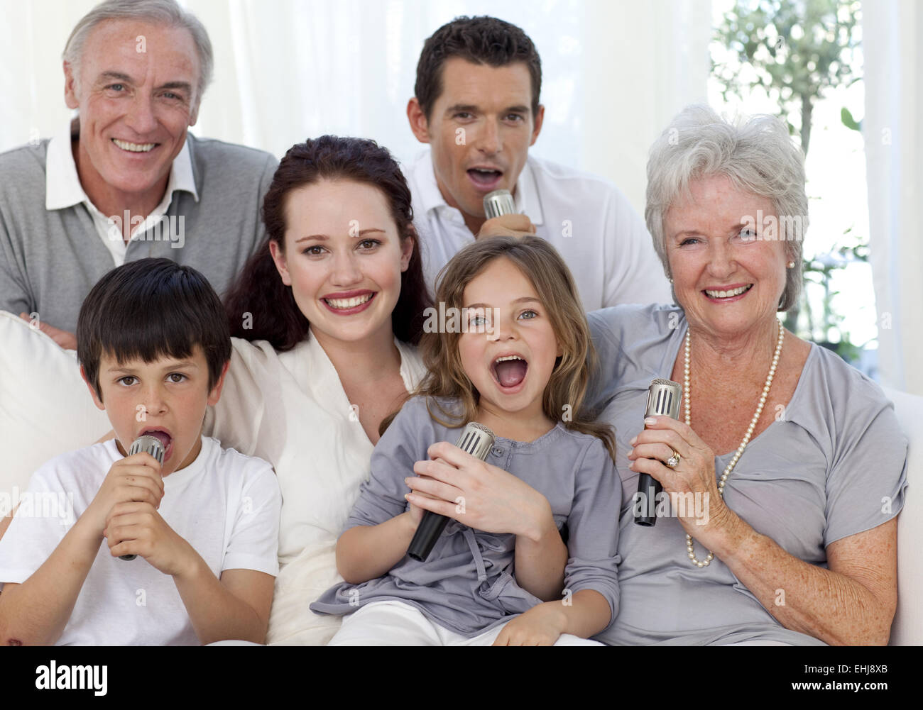 Mother daughter singing karaoke hi-res stock photography and images - Alamy