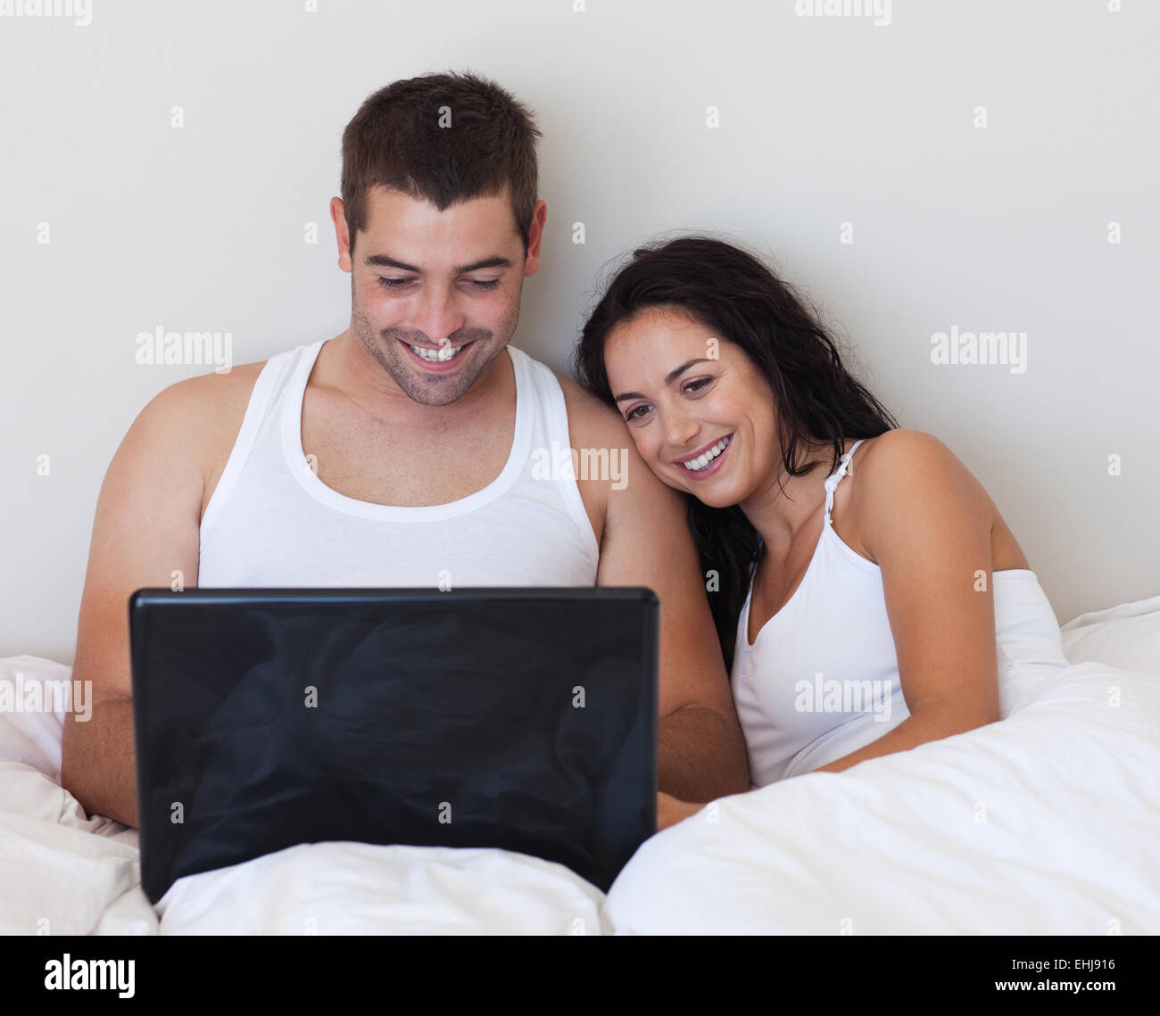 Husband and wife lying in bed Stock Photo - Alamy