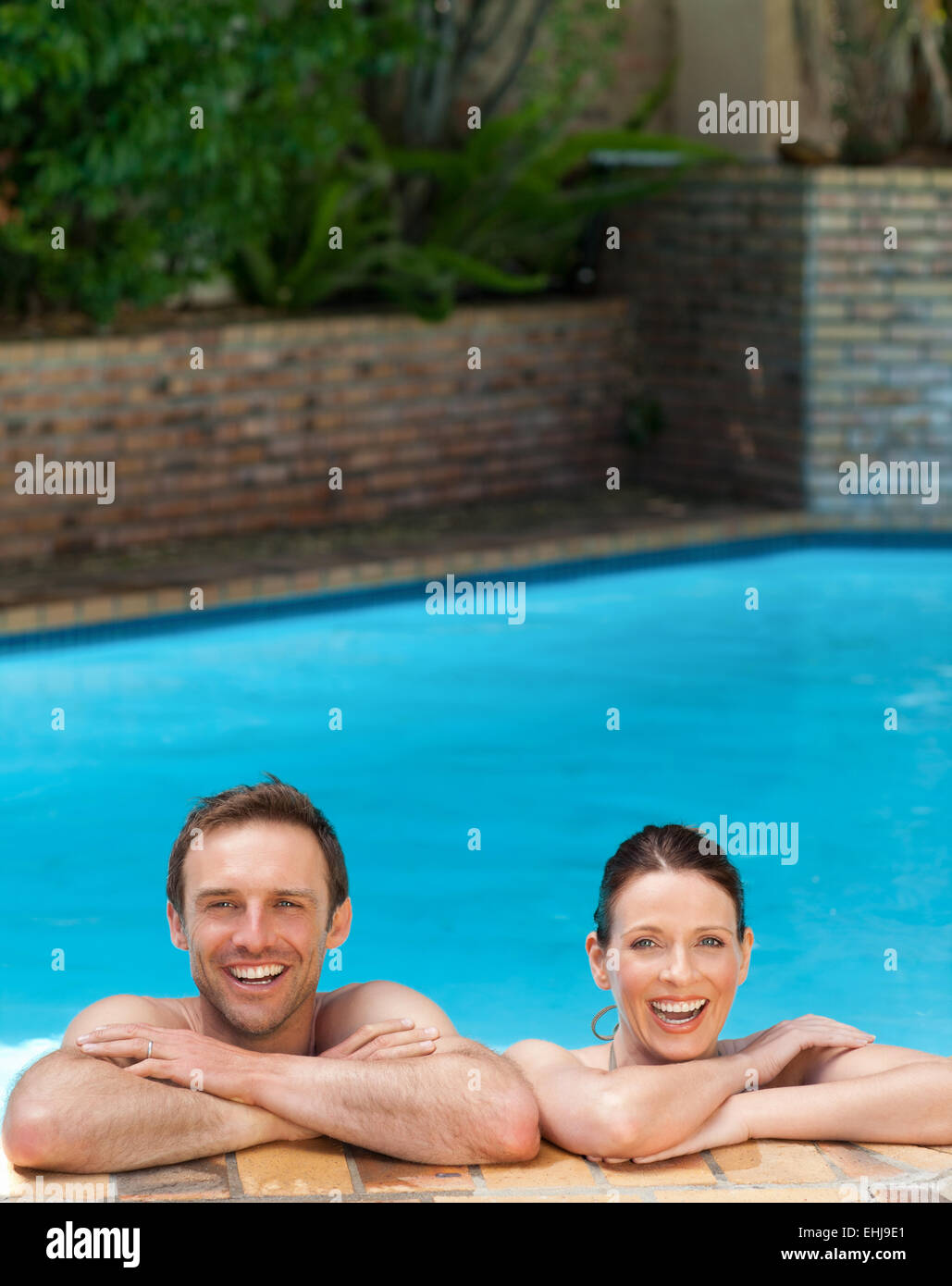 Lovely couple in the swimming pool Stock Photo - Alamy