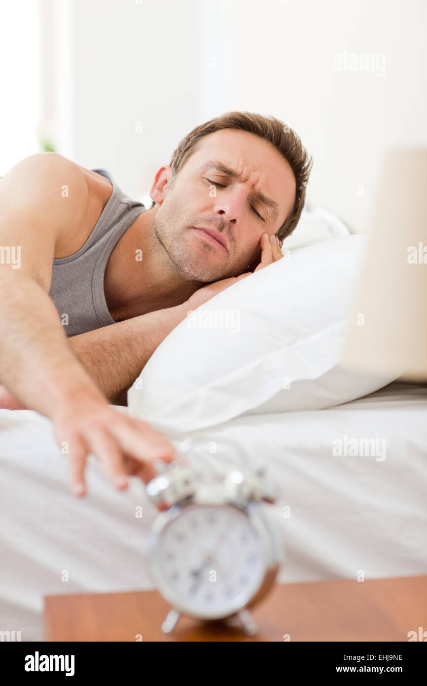 Man waking up in his bed Stock Photo - Alamy