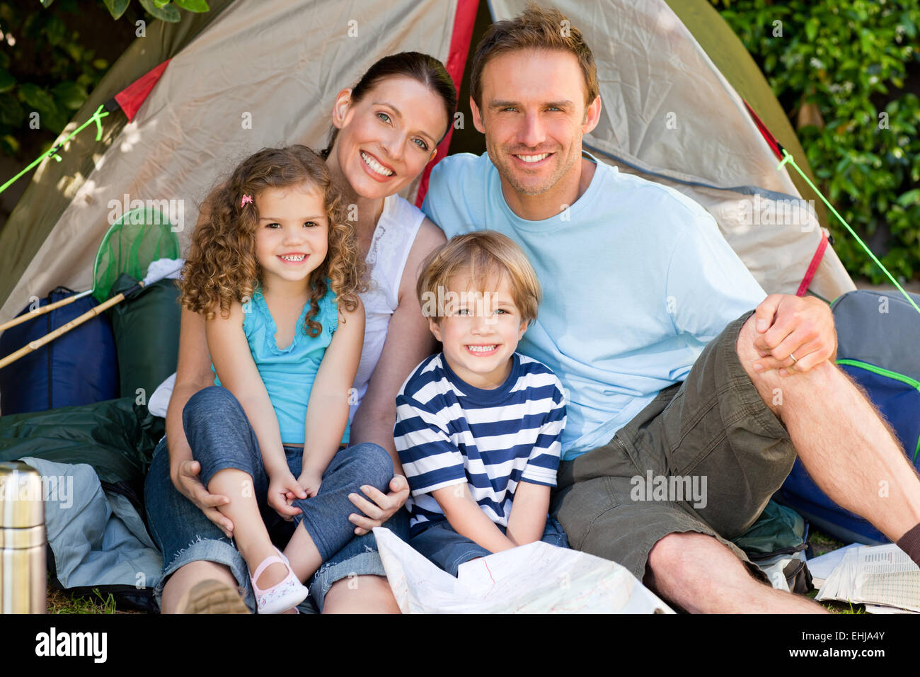 Adorable family camping in the garden Stock Photo - Alamy