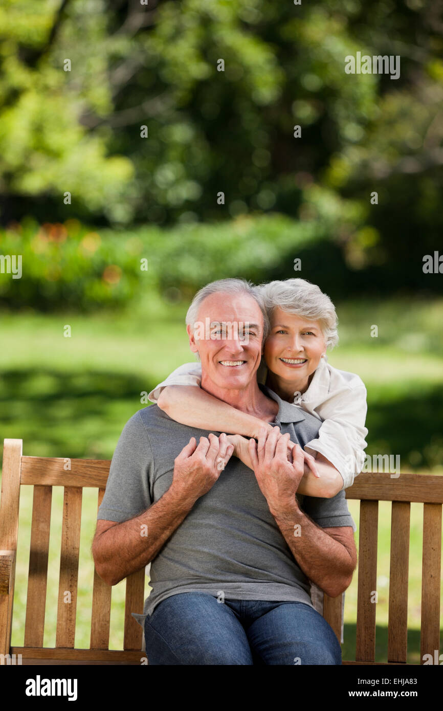 Mature couple hugging in the garden Stock Photo - Alamy