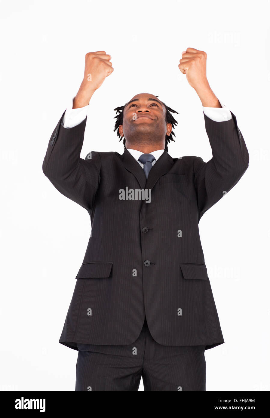 Businessman with raised arms looking upwards Stock Photo - Alamy