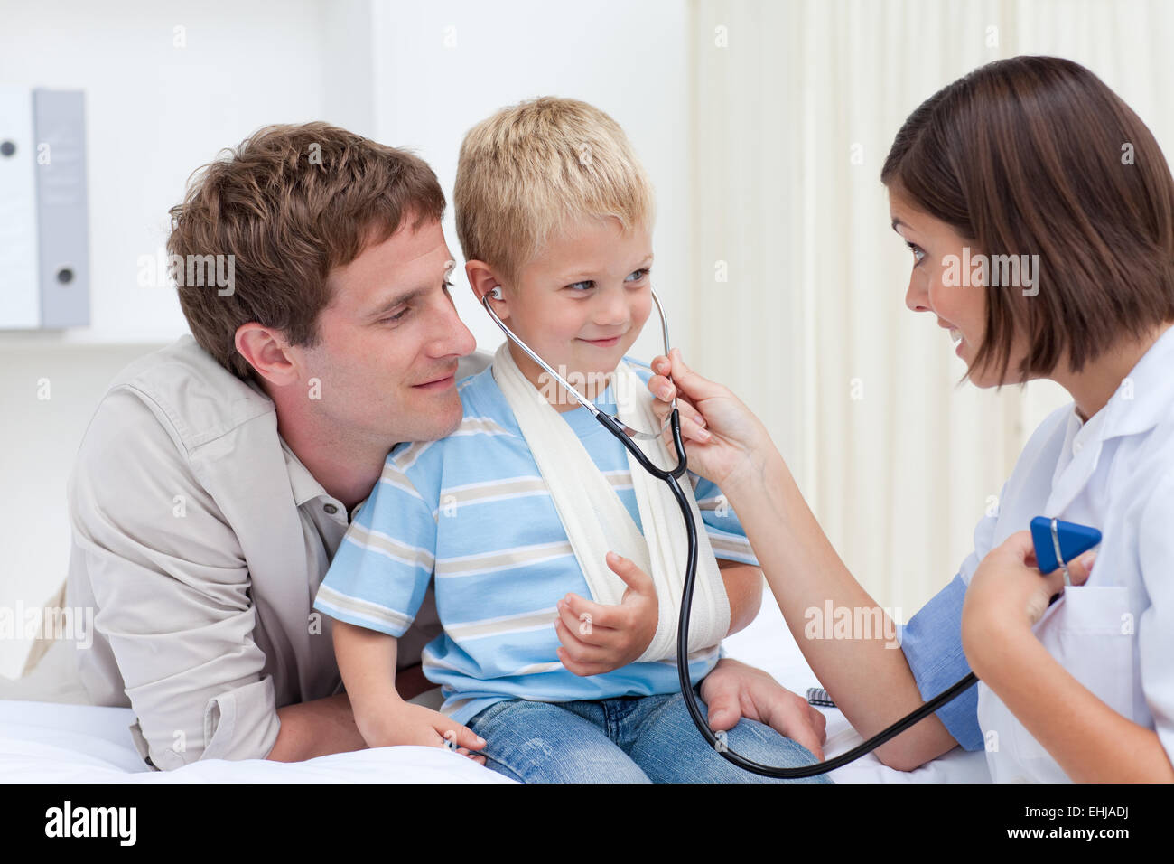 Female doctor playing with a little child Stock Photo - Alamy