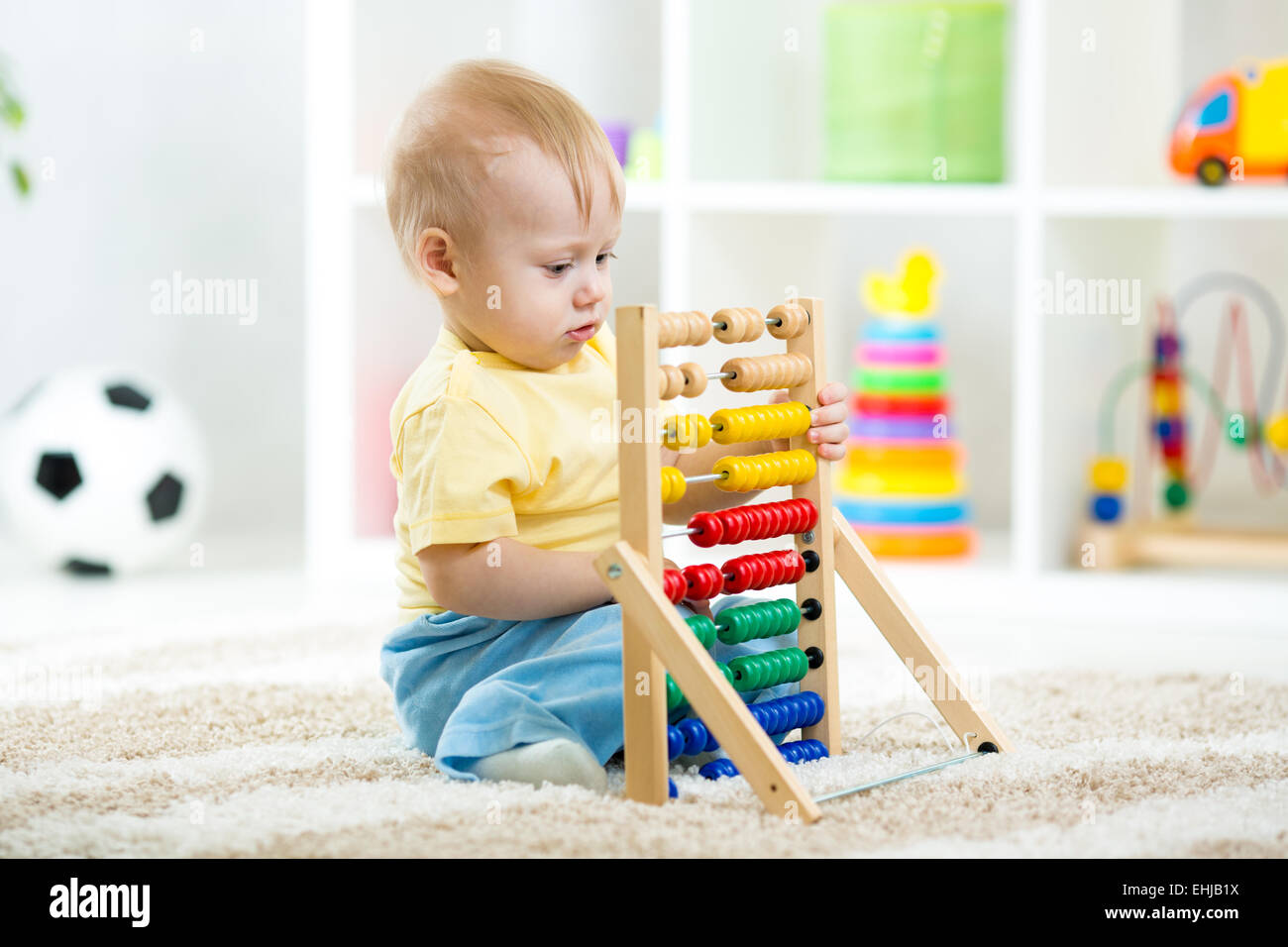 kid boy playing with counter Stock Photo - Alamy