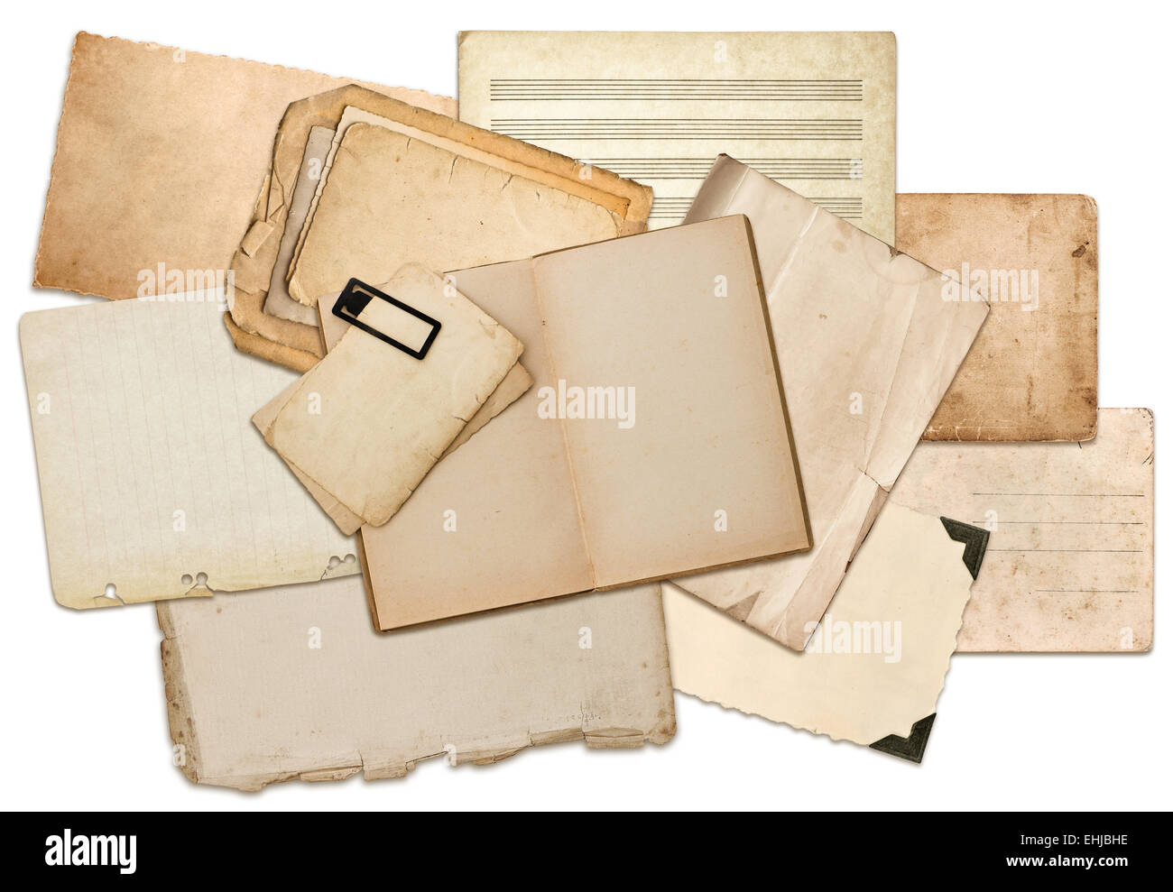 stack of old paper sheets, book pages, cardboards, photo frames with ...