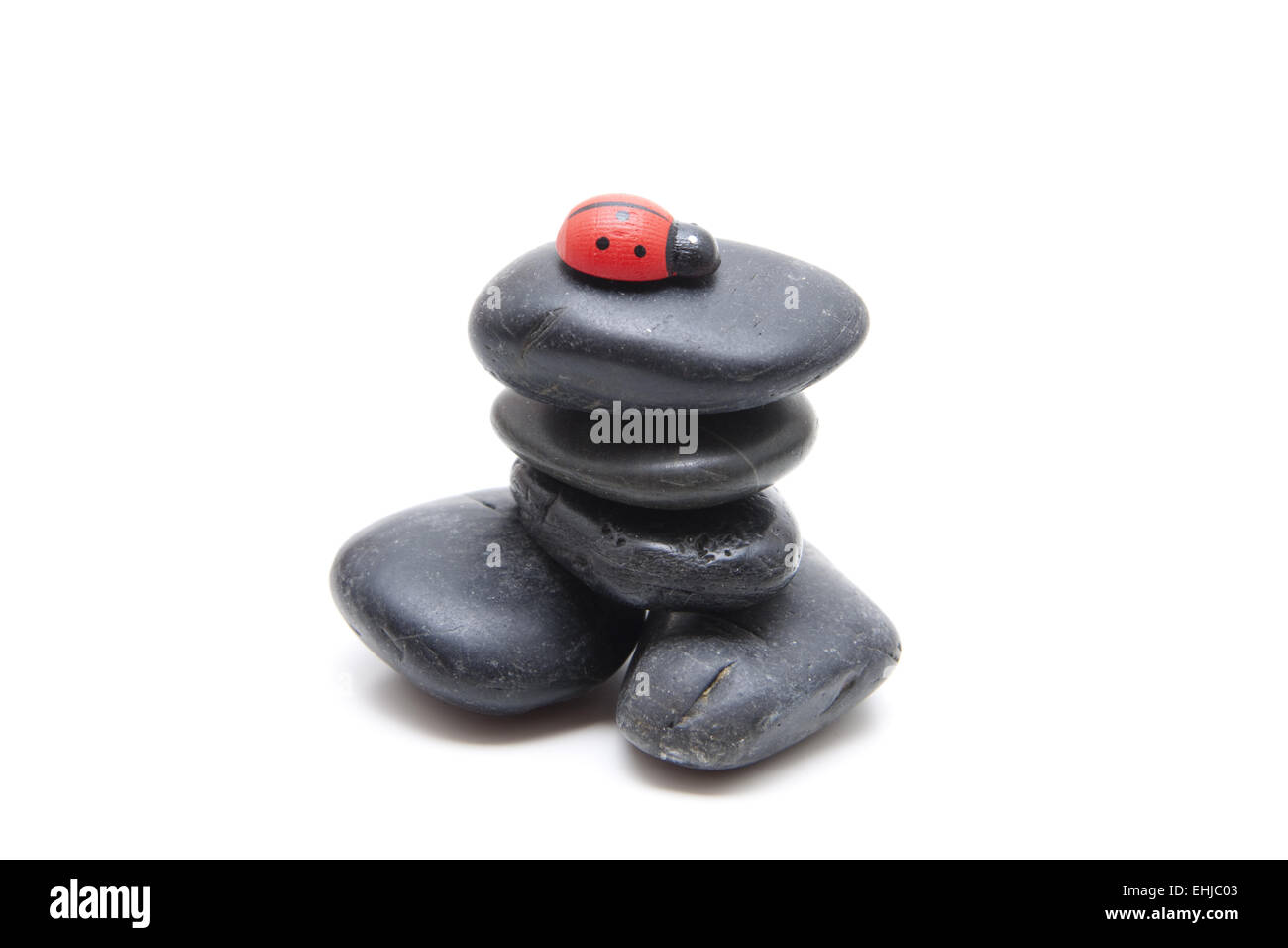 Stones with ladybug Stock Photo - Alamy