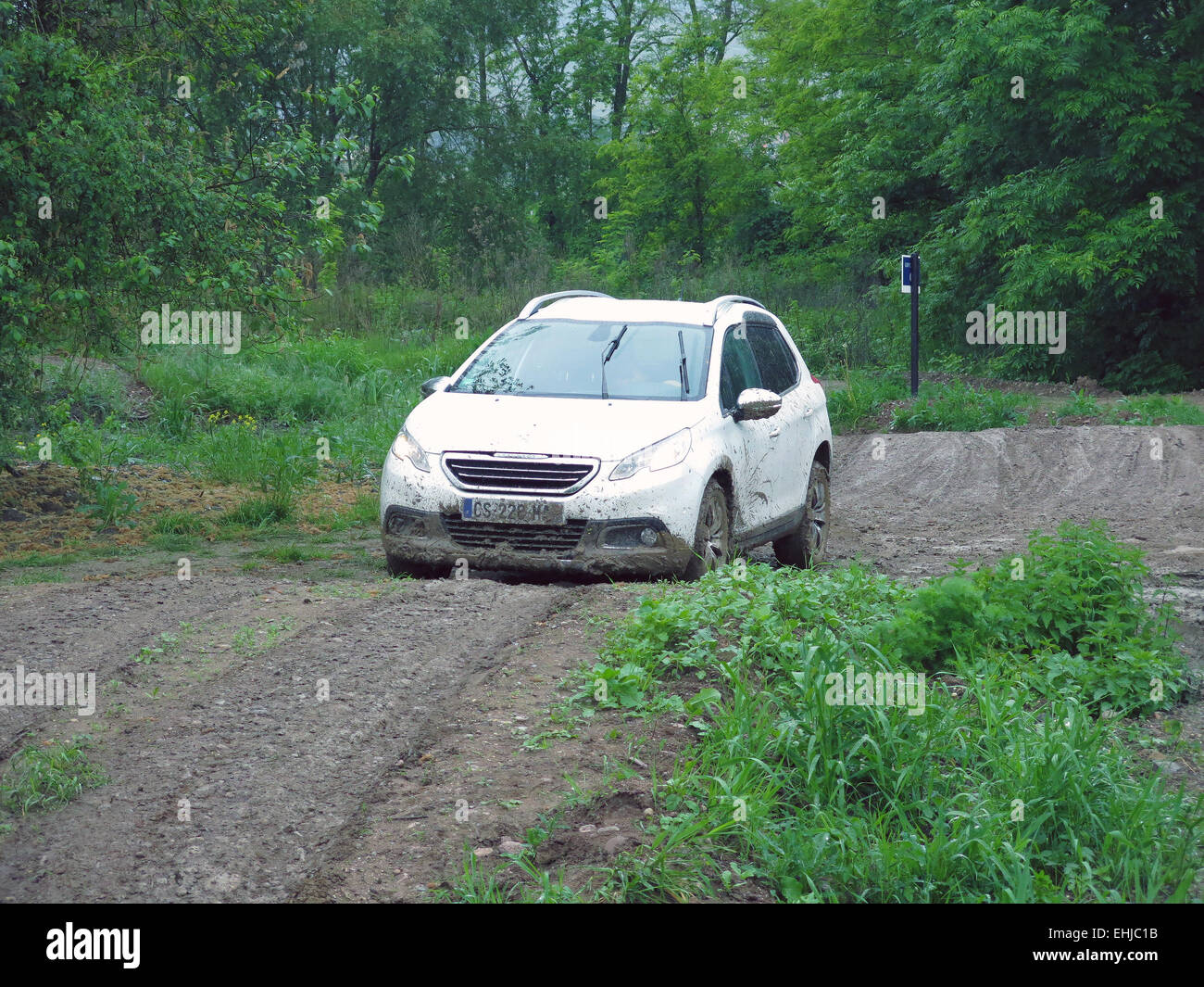 Car on a muddy road in a French countryside Stock Photo - Alamy