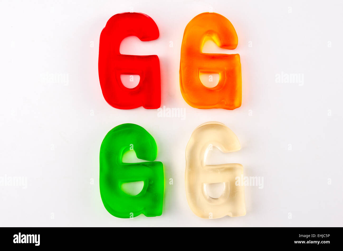 A set of four gummy letters in the shape of G isolated on white Stock ...