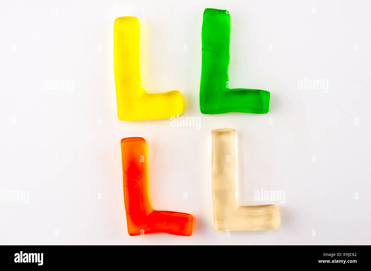 A set of four gummy letters in the shape of L isolated on white Stock ...