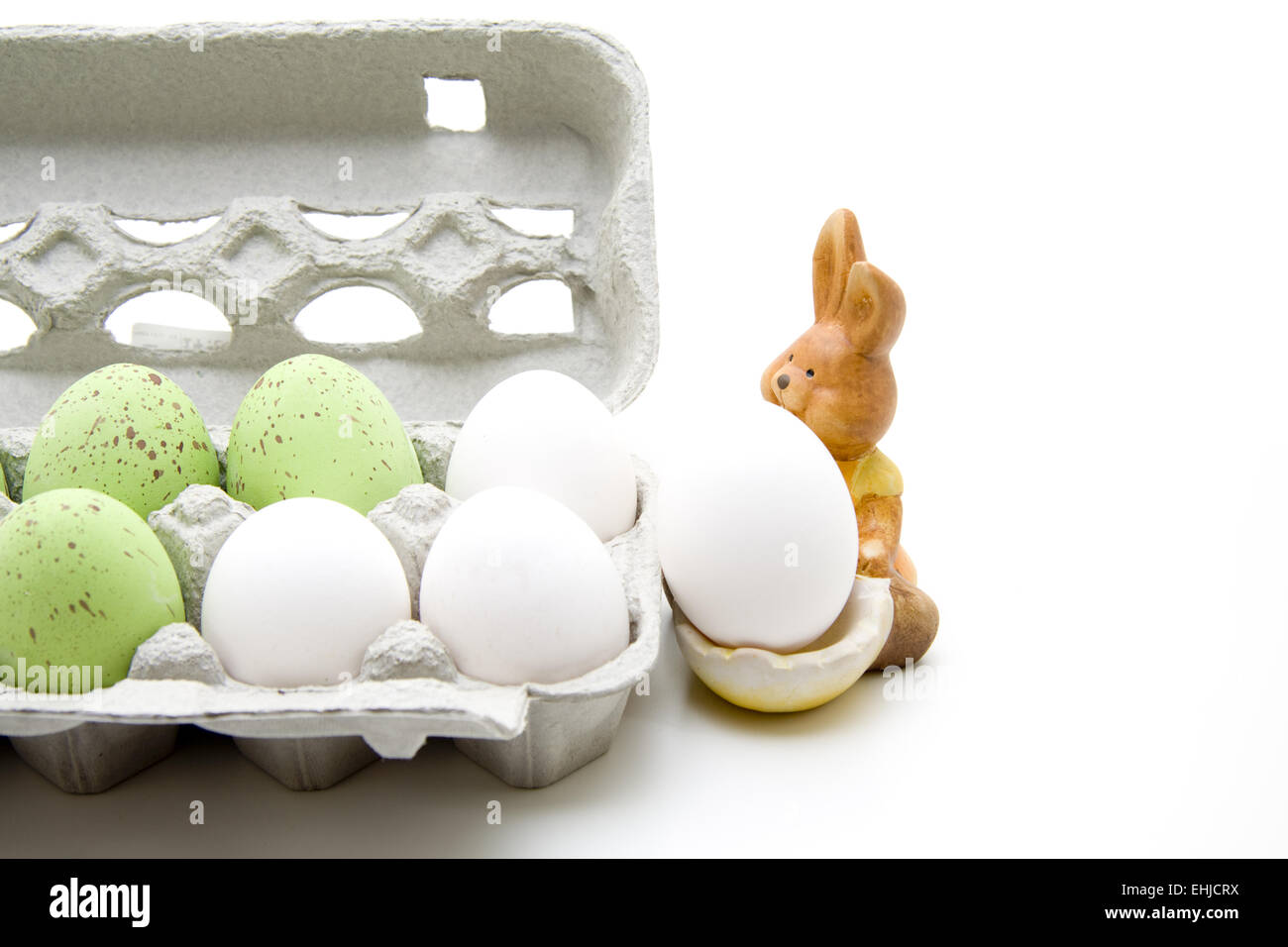 Easter bunny with egg and egg carton Stock Photo - Alamy